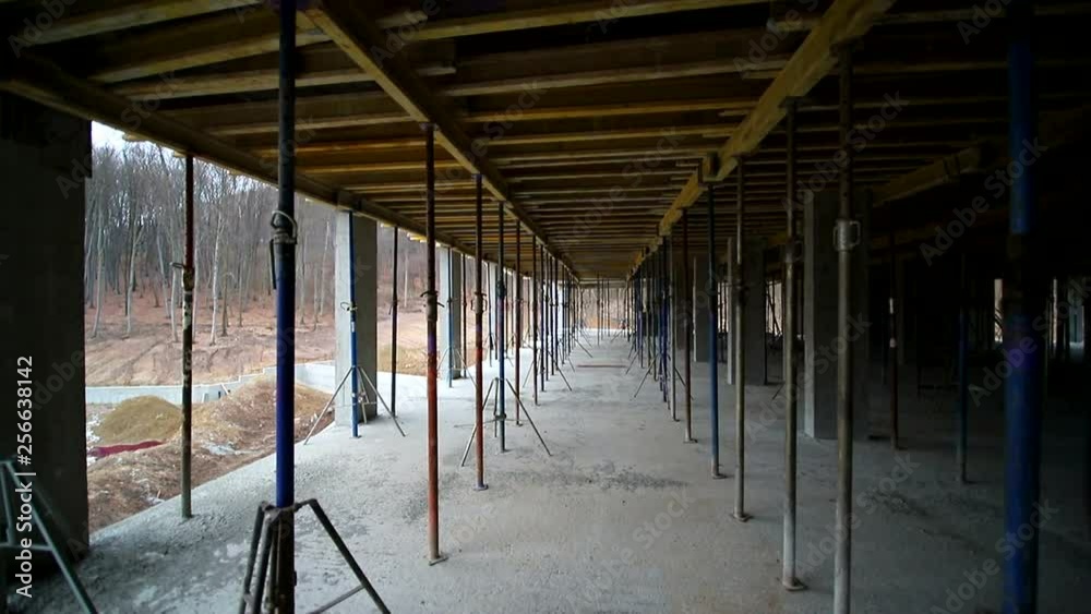 Movement of the camera between the building supports that support ...