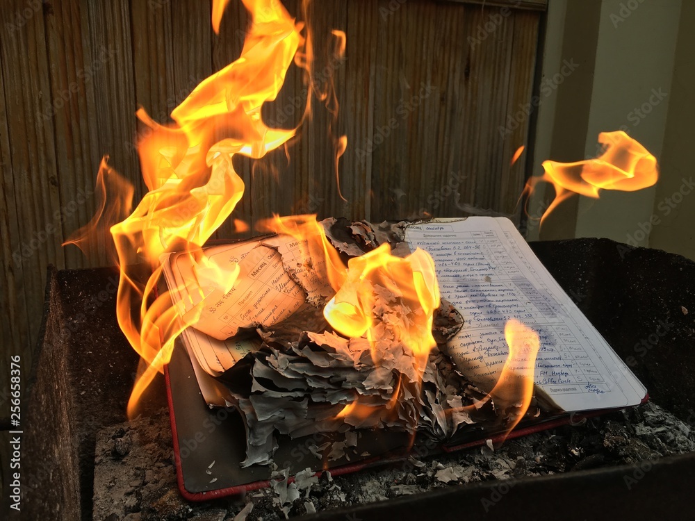 School diary with daily hand written note burning in fire flame Stock ...