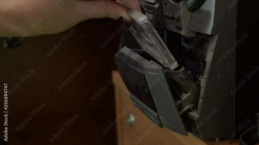 Installation of an audio cassette in a tape recorder in a broadcasting ...