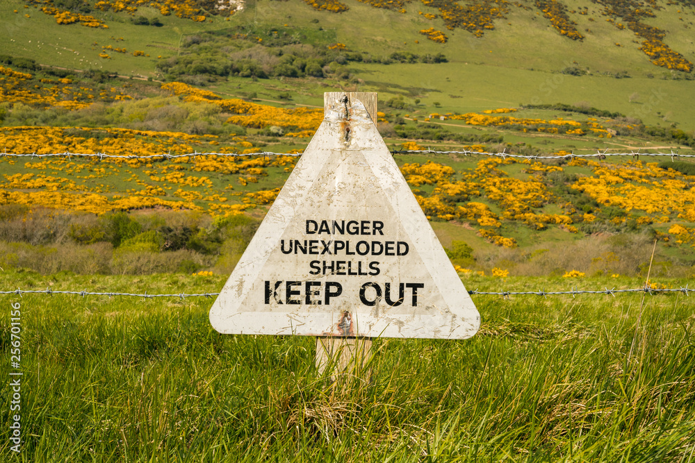 Sign: Danger unexploded shells keep out, seen on the South West Coast ...