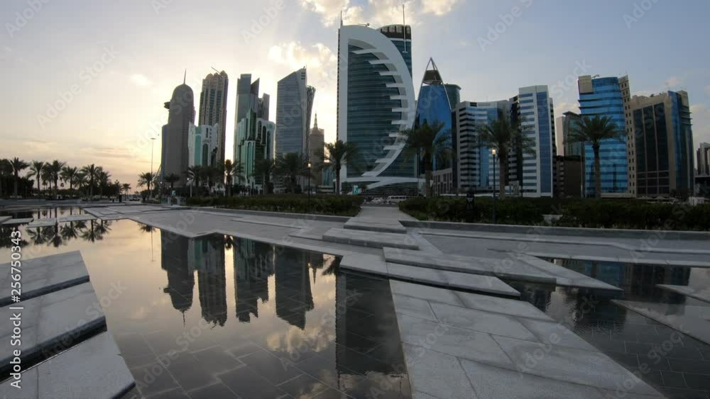 Stockvideon Doha West Bay high rises at sunset light reflecting in the ...