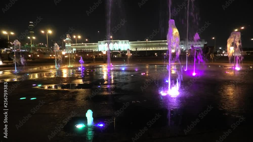 Colorful water fountain at Souq Waqif Park at Doha Corniche with Al ...