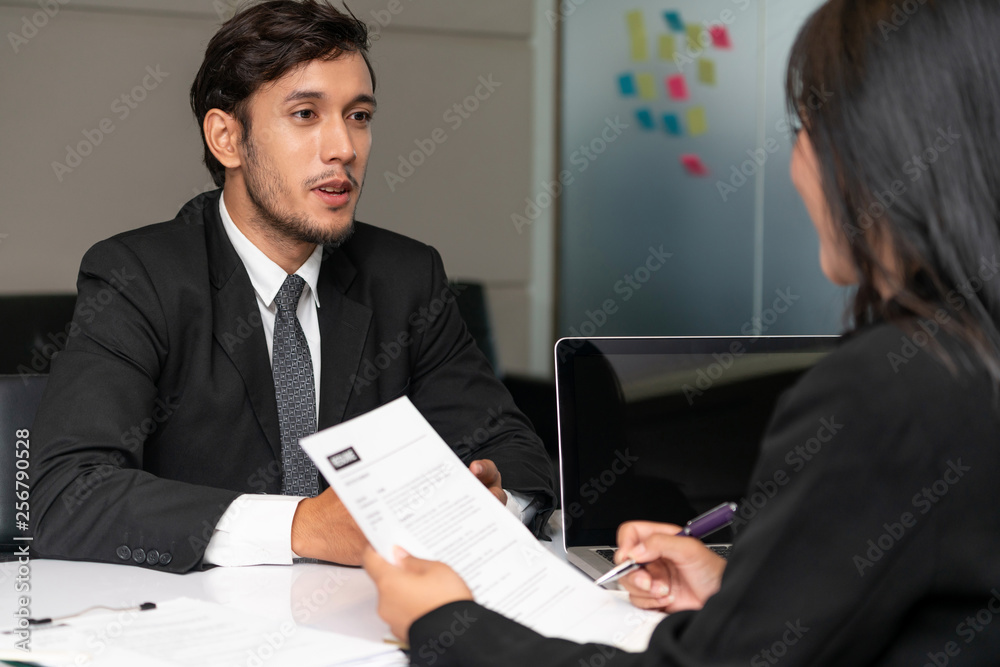 Human resource manager interviewing the male employment candidate in ...