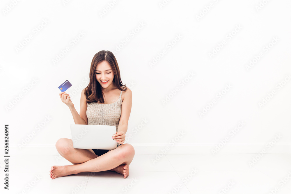 Beautiful woman shopping online with technology of laptop computer and ...