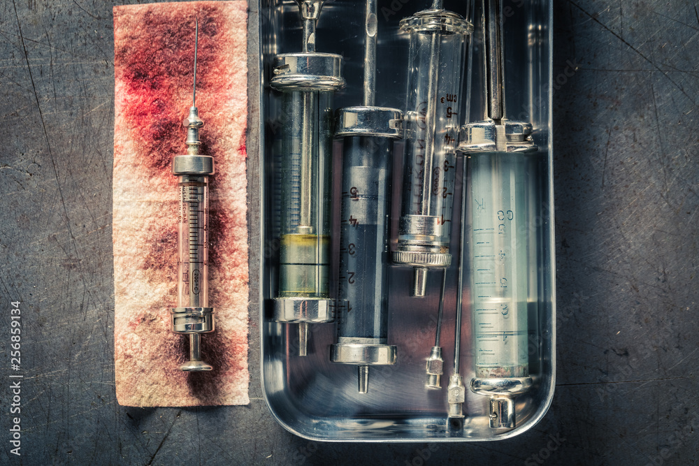 Antique syringes with a needle in a stainless steel container Stock ...