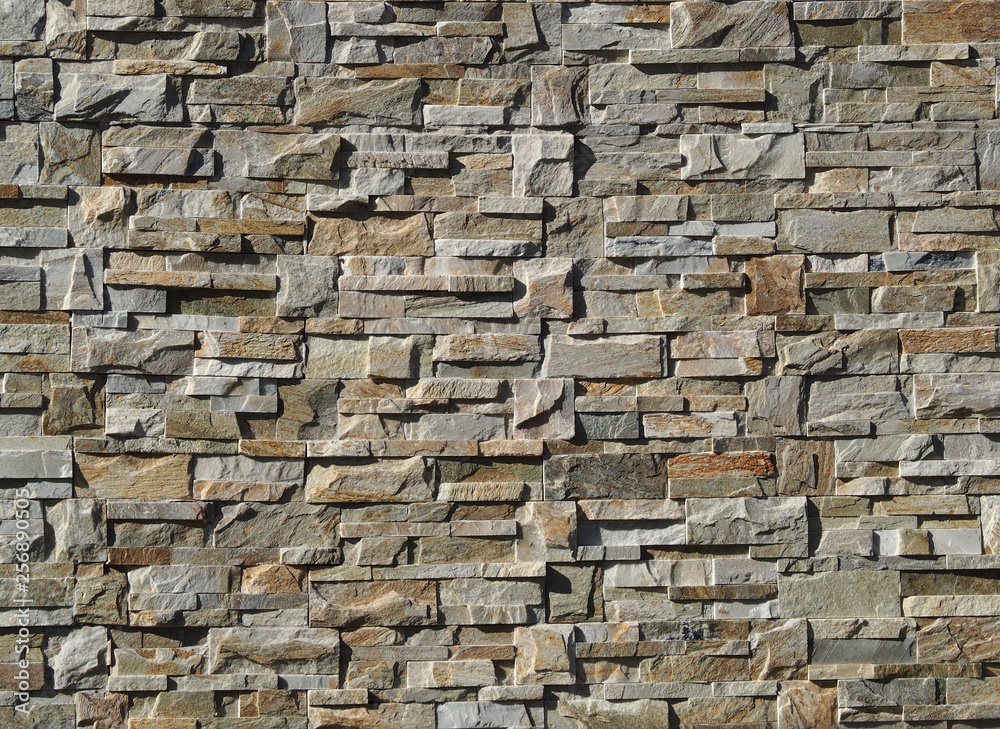 Exterior wall cladding made of natural stones with irregular shapes ...
