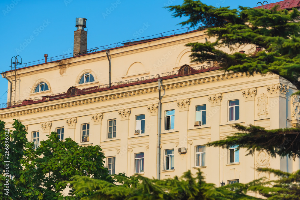 Vintage architecture. Storey buildings of light color. Walk around town ...