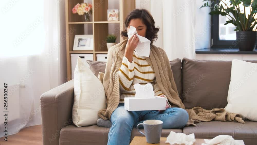 healthcare, cold, hygiene and people concept - sick woman in blanket ...