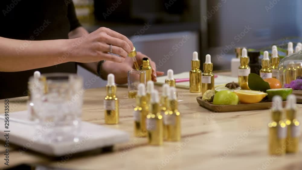 Close up of perfumer adding essential oil in beaker vídeo de Stock ...