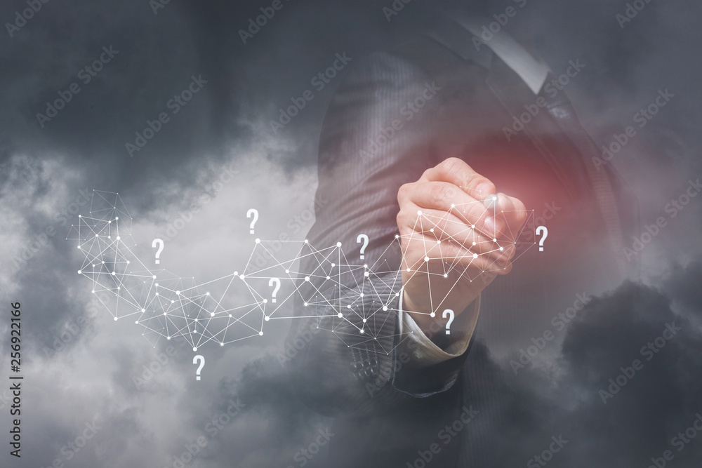 A businessman working with question marks and wireless connection ...