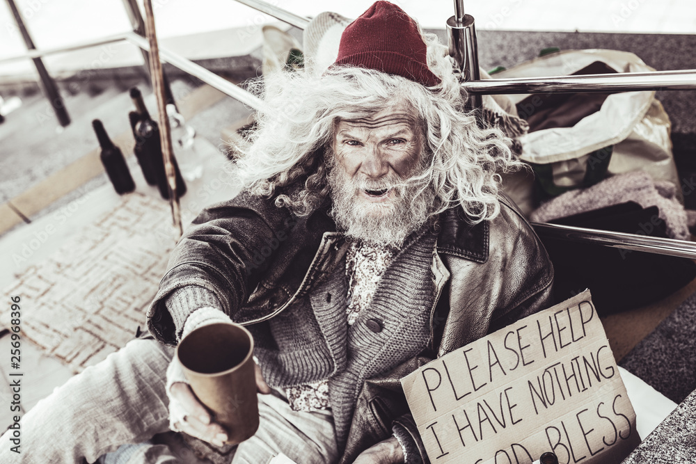 Homeless old man trying to move to pity pedestrians. Stock Photo ...