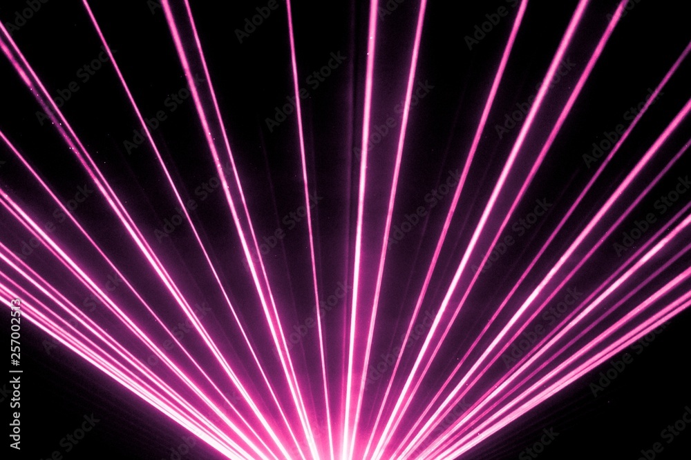 Pink laser show nightlife club stage and shining sparkling rays. Luxury ...
