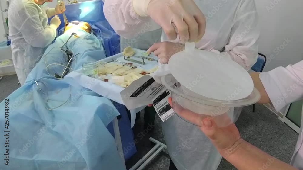Breast implant. Surgical breast augmentation. Installation of a breast ...
