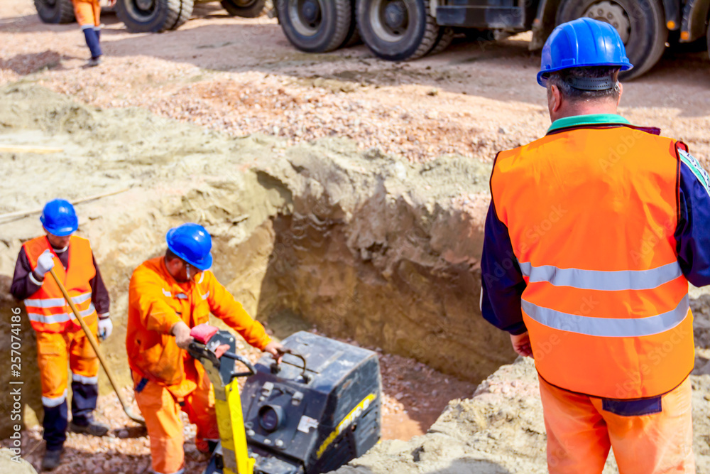 Boss oversees, control work on construction site Stock Photo | Adobe Stock