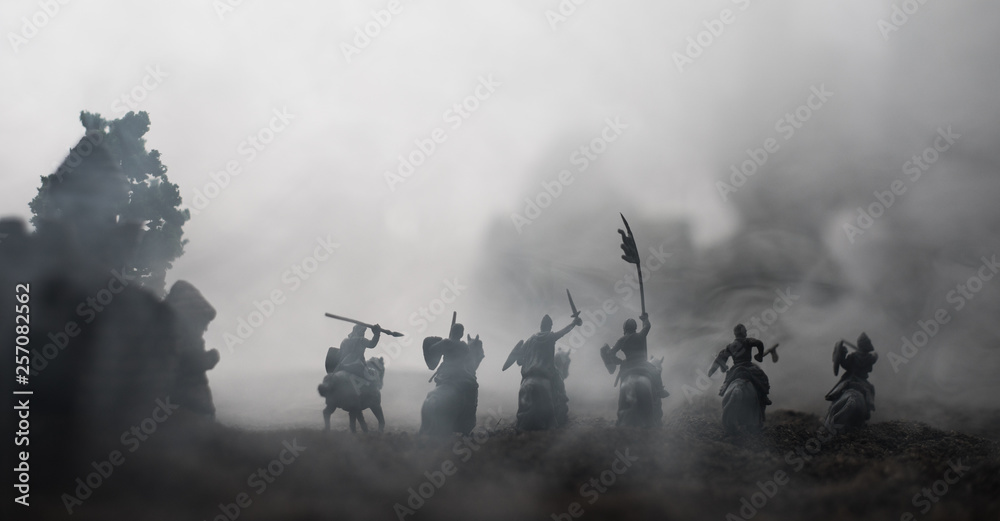 Medieval battle scene with cavalry and infantry. Silhouettes of figures ...