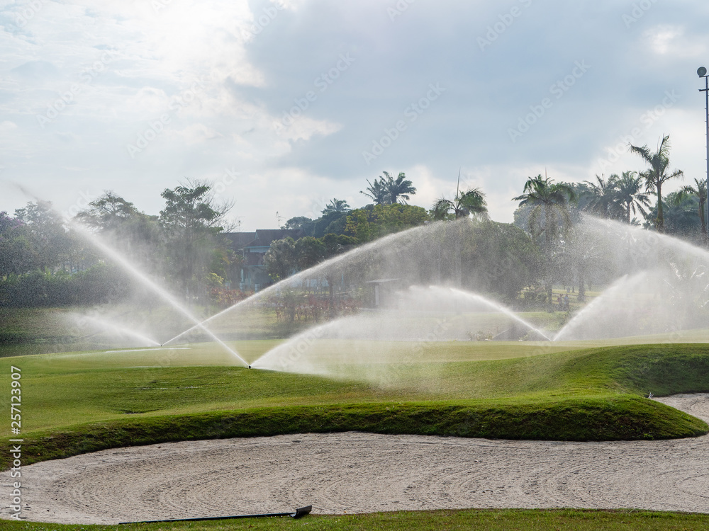Irrigation of golf course Stock Photo | Adobe Stock