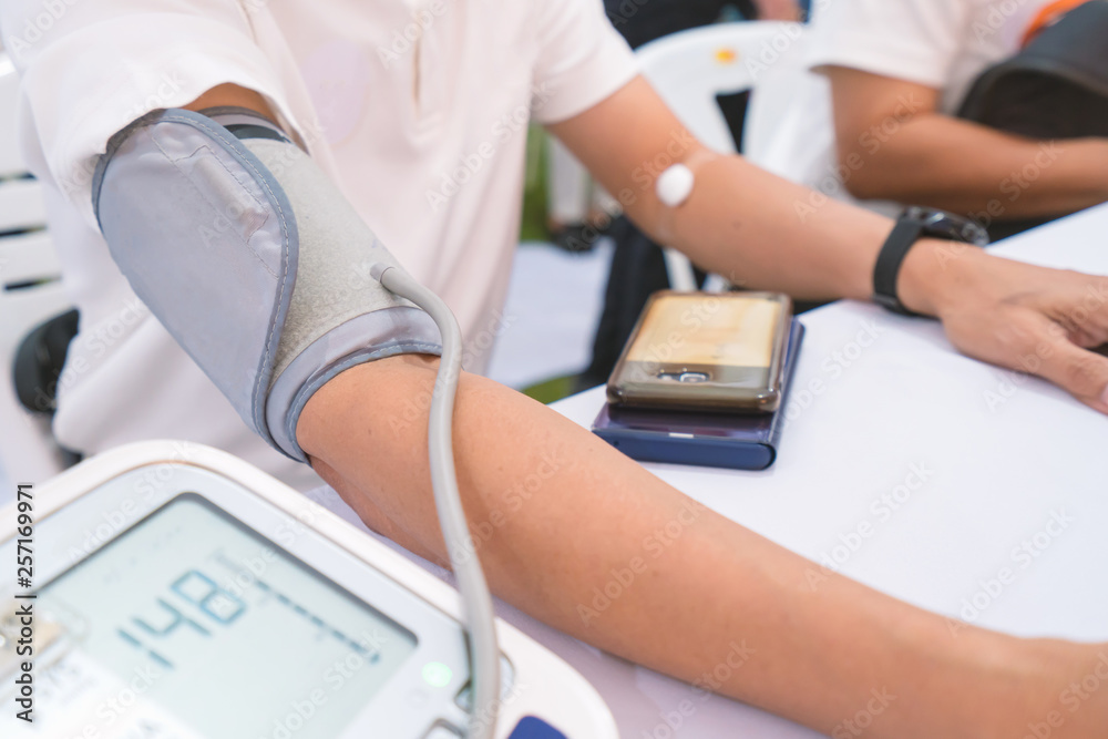 Doctor checking patient arterial blood pressure in hospital. Health ...