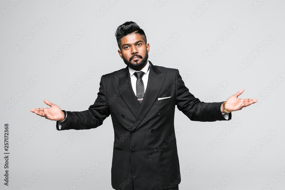Portrait, dumb clueless young indian man, arms out asking why what's ...