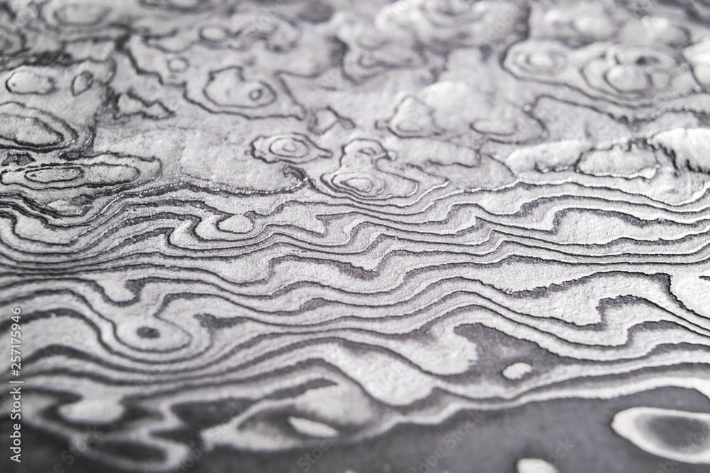 Background with pattern of damask steel. Close up. Macro shot of a ...