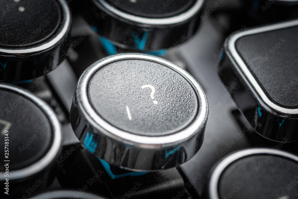 An extreme close-up or macro shot of a round slash and question mark ...