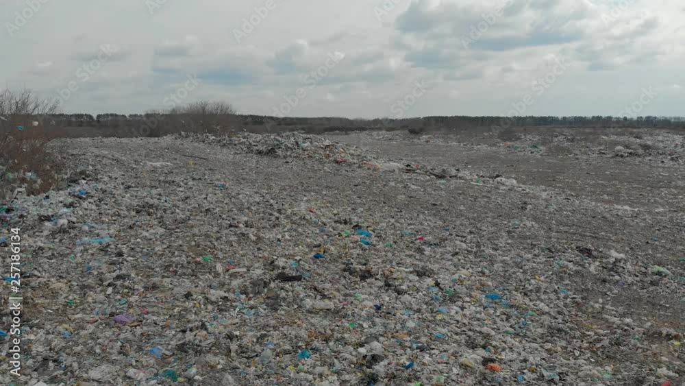 A large landfill of garbage and household waste is polluting the ...