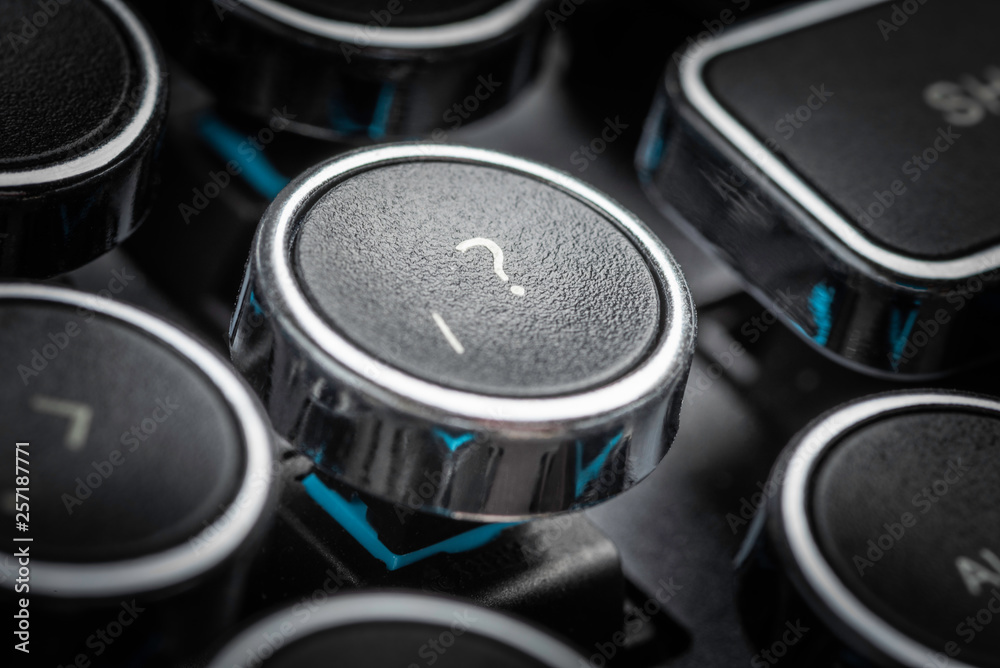 An extreme close-up or macro shot of a round slash and question mark ...