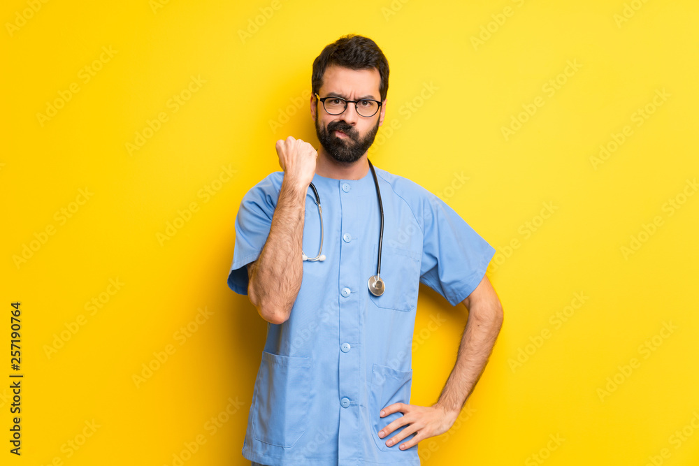 Foto de Surgeon doctor man with angry gesture do Stock | Adobe Stock