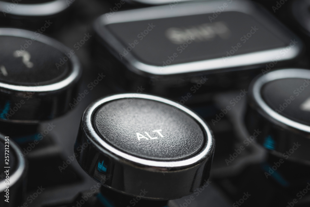 An extreme close-up or macro shot of a round ALT key on a vintage ...