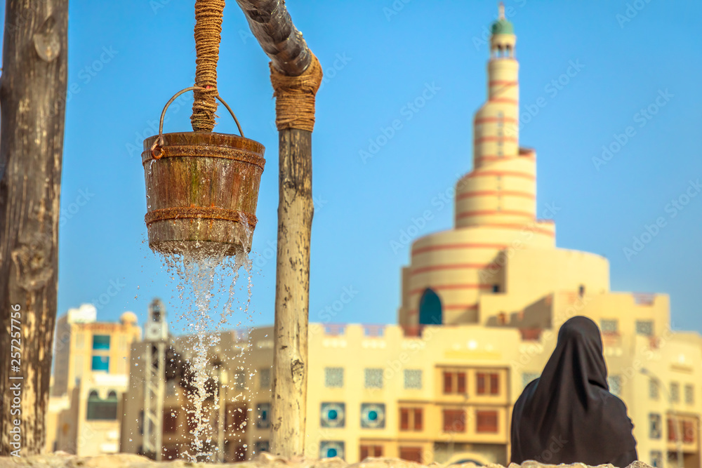 Closeup of flowing water at old fountain at Souq Waqif in Doha center ...