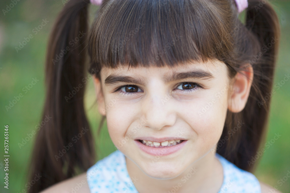 Childhood concept. Portrait of a cute little girl outdoors Stock Photo ...