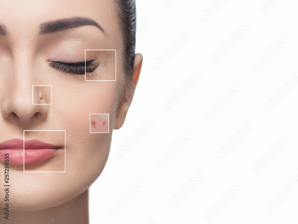 Portrait of a beautiful woman on a white background, on the face are ...