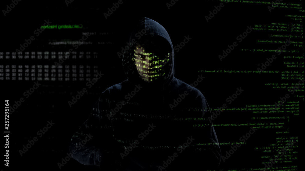 Incognito man looking at codes and numbers on screen, hacker attack ...