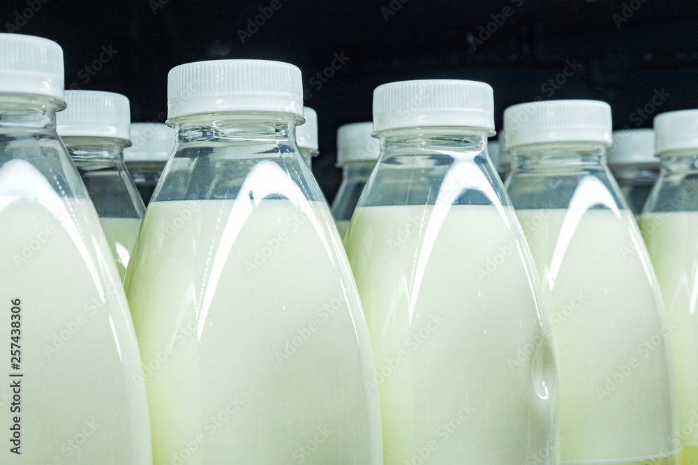 Bottles of milk close up, show on a shelf for sale in a supermarket ...