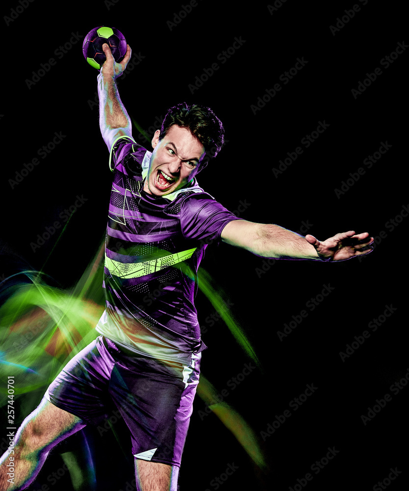 one caucasian handball player young man isolated on black background ...