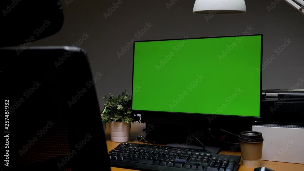 Dolly shot 4K Chroma Key Green screen background of computer monitor ...