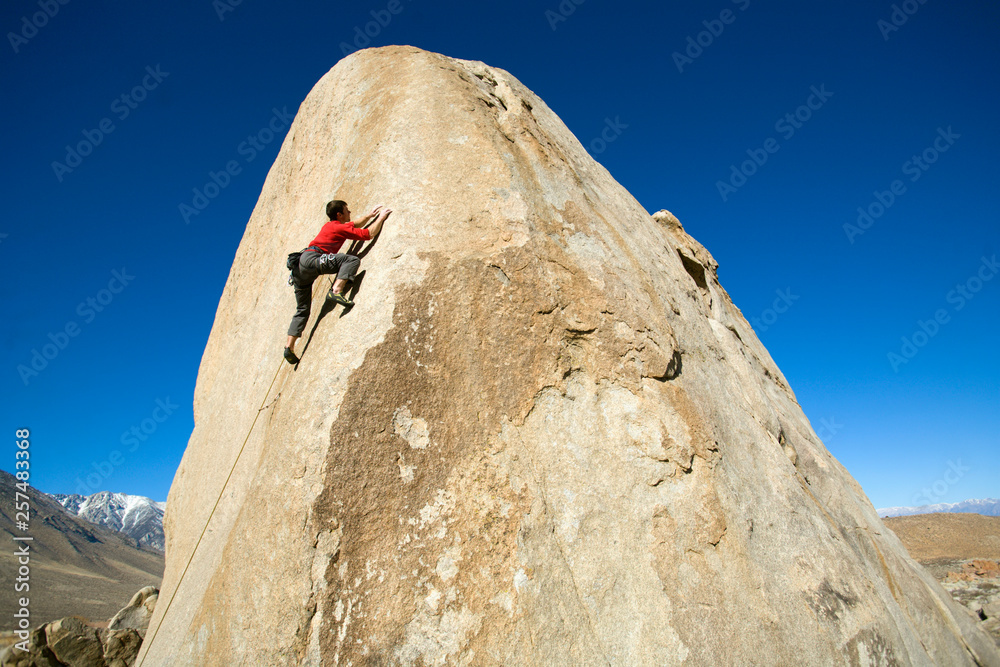 Mitch Underhill lead climbing a route in Owens River Gorge near Bishop ...