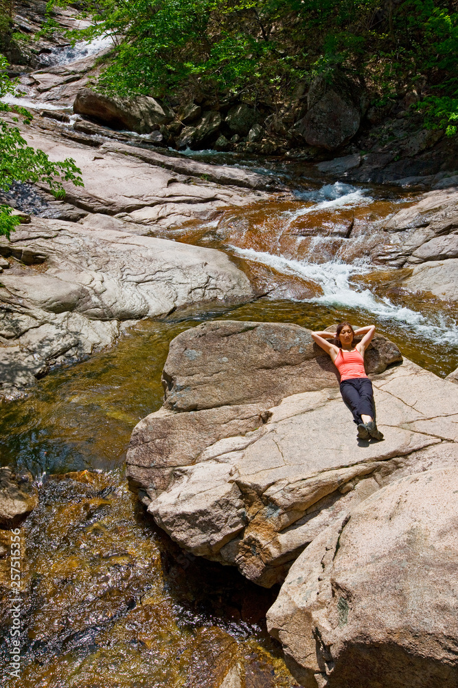 Woman sunbathing on a rock at Seoraksan Nationalpark Stock Photo ...