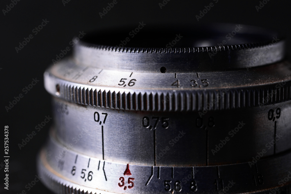 Old vintage lens scales symbols closeup. Photo with blurred gray ...