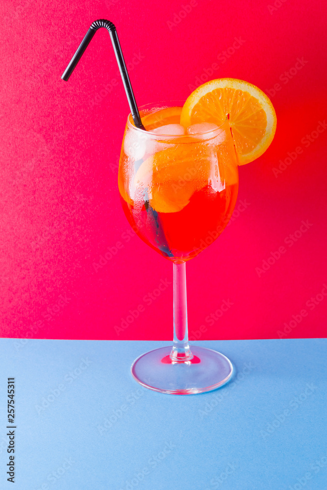 Cocktail aperol spritz on red blue background. Summer alcoholic ...