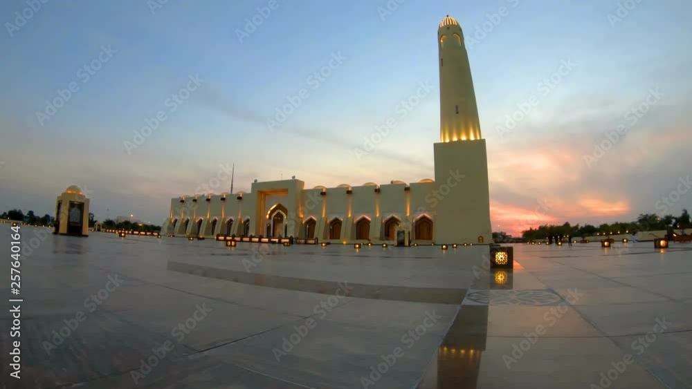 State Grand Mosque with a minaret at sunset light. Doha mosque in ...