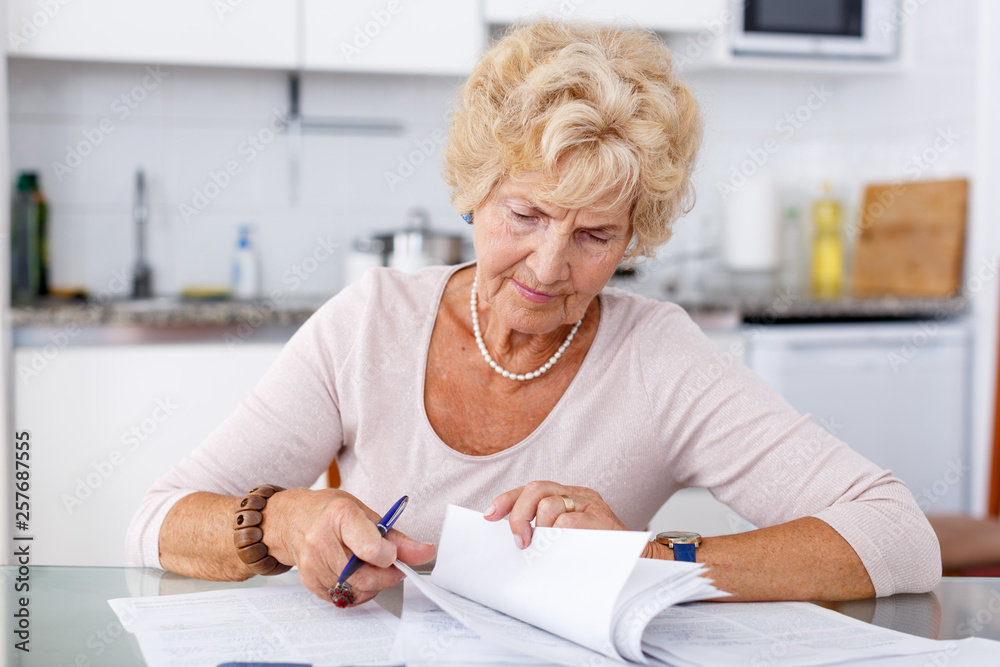 Woman filling up documents Stock Photo | Adobe Stock
