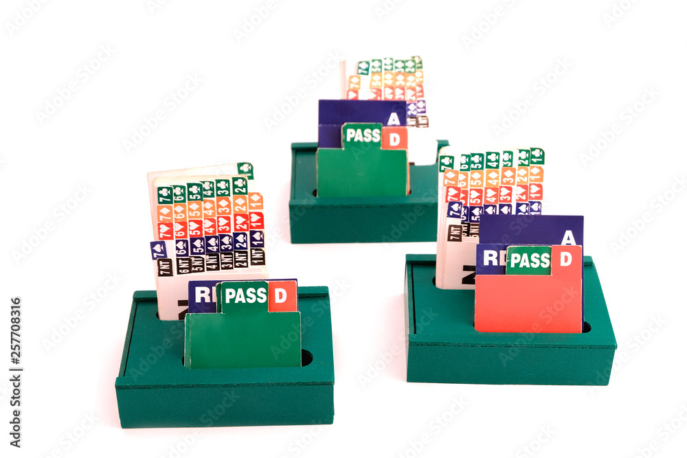 Three boxes on a white background. Three boxes for the game of bridge ...