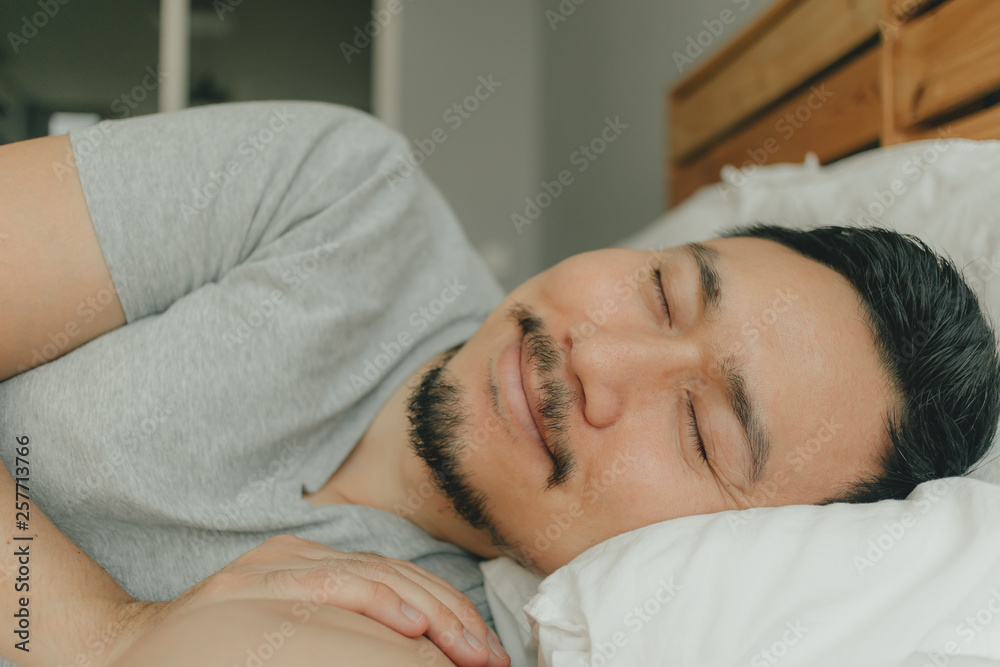 Close up man sleeping on his bed with happy face. Concept of happy ...