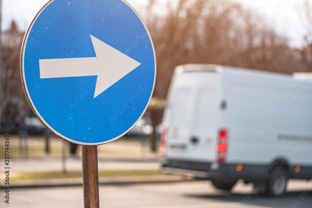 Proceed in direction arrow traffic sign Stock Photo | Adobe Stock