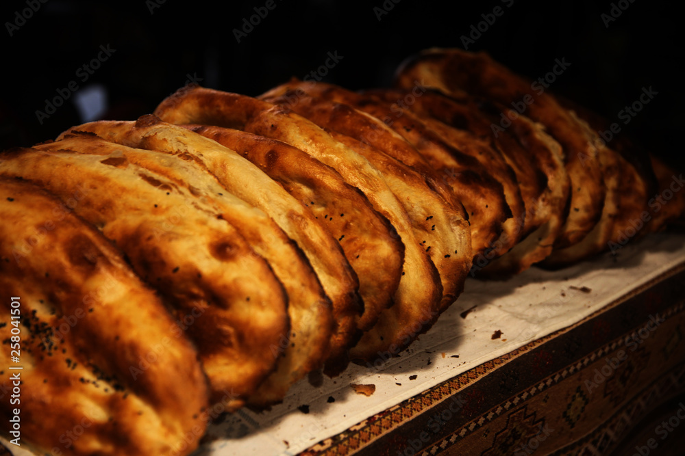 Traditional Azerbaijani tandoor bread baked in a clay oven called a ...