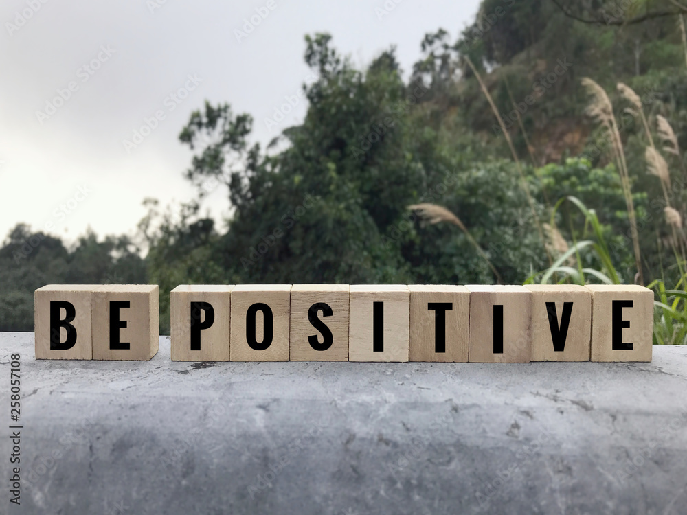 Motivational and inspirational wording - BE POSITIVE written on wooden ...
