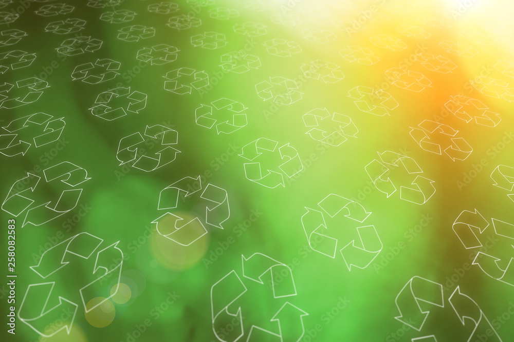 Lovely sunny blurred nature bokeh with recycle symbols. Conceptual ...