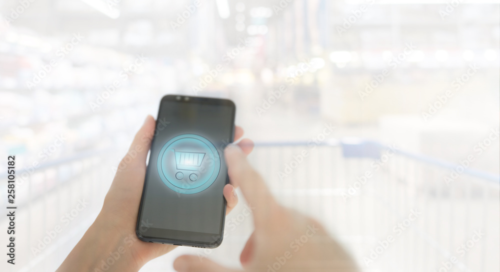 Smart phone online shopping in woman hand. Shopping center in ...