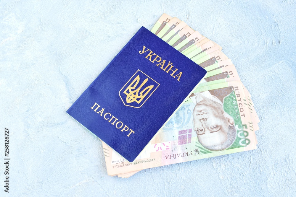 Internal passport of Ukraine with the national currency hryvnia inside ...