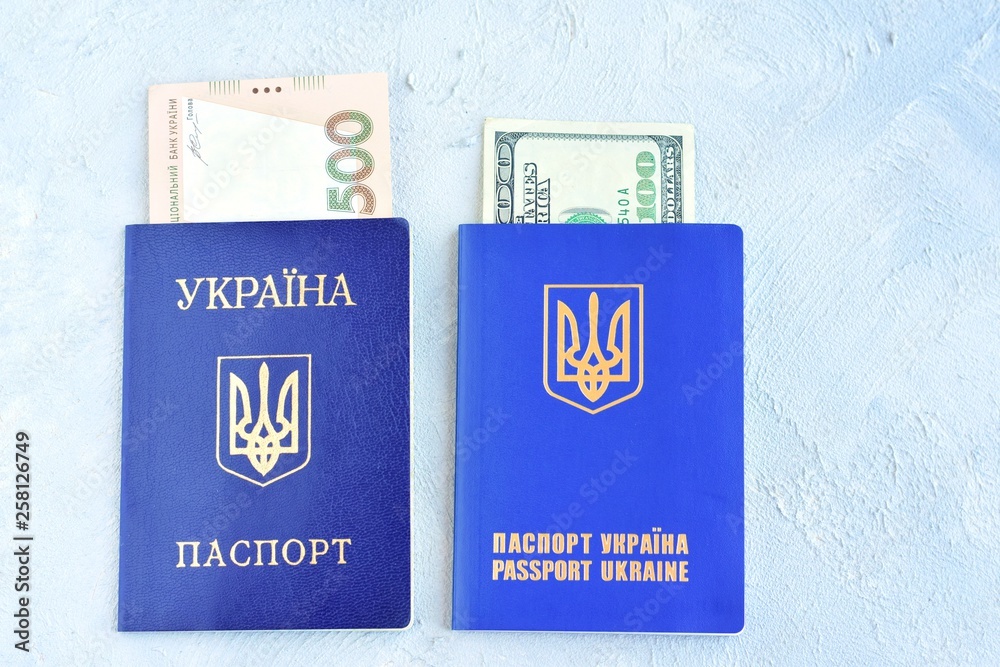 Internal passport of Ukraine with the national currency hryvnia inside ...